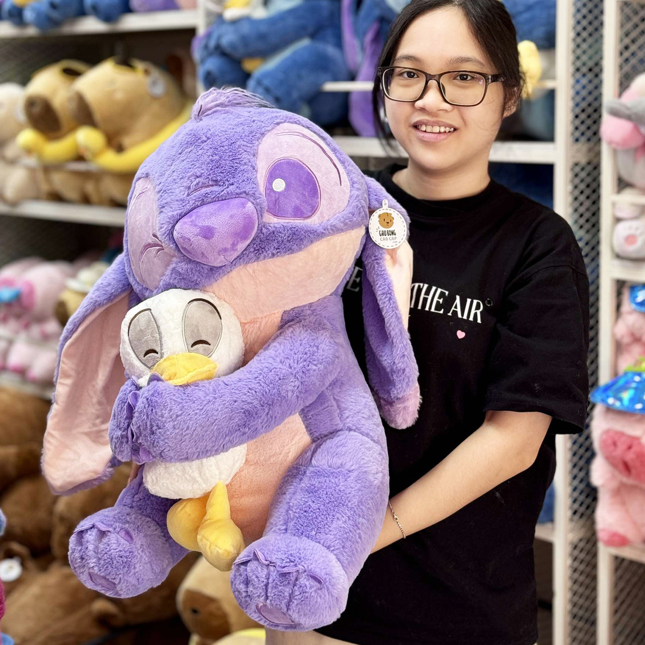 Gấu Bông Stitch Tím ôm Vịt Trắng - Shop Gấu Bông Stitch - gaubongcaocap.com